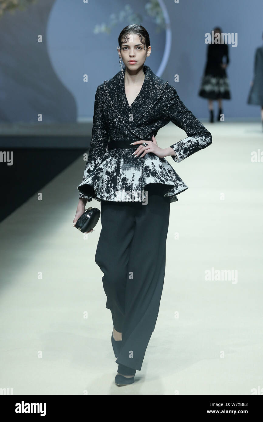 A model displays a new creation at the fashion show of Heaven Gaia by ...