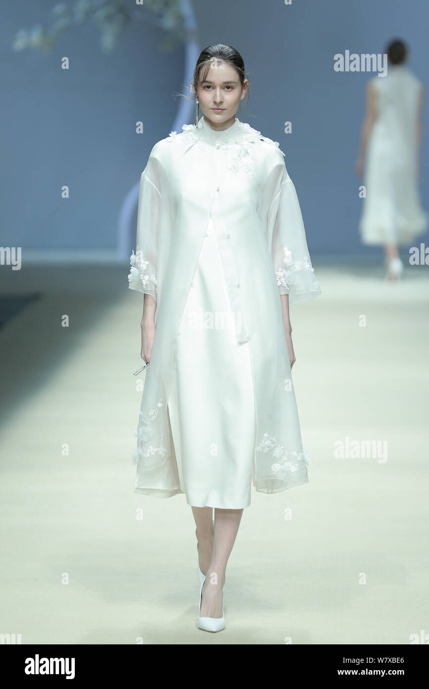 A model displays a new creation at the fashion show of Heaven Gaia by ...
