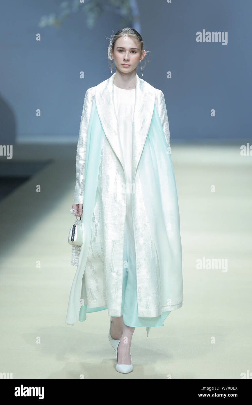 A model displays a new creation at the fashion show of Heaven Gaia by ...