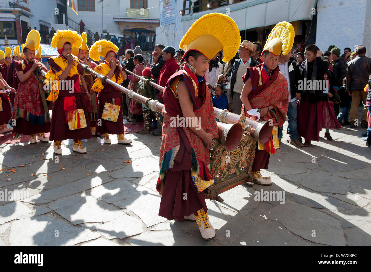 Buddhist monks playing long trumpets (Lawa) during Torgya festival ...