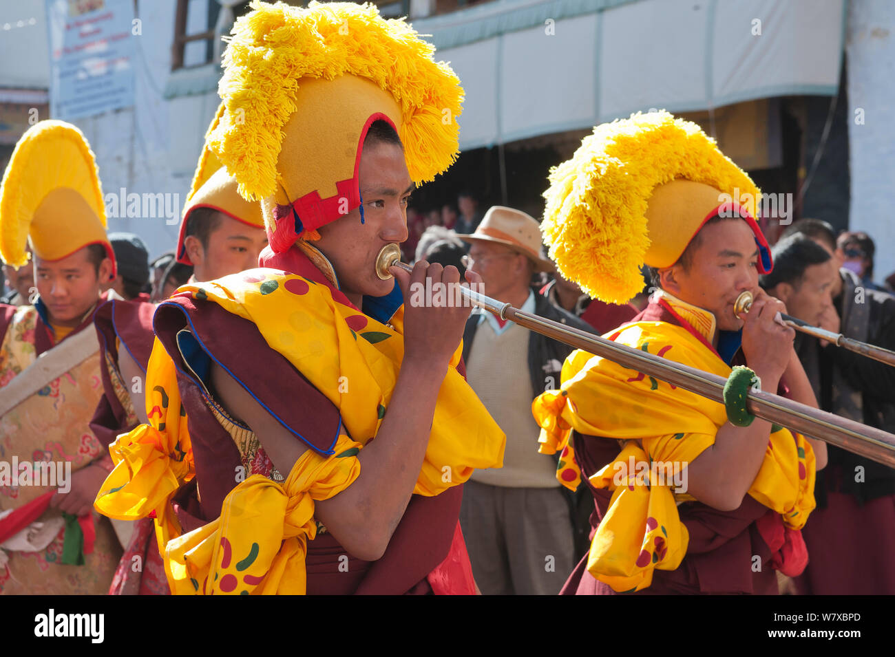 Buddhist monks playing long trumpets (Lawa) during Torgya festival ...