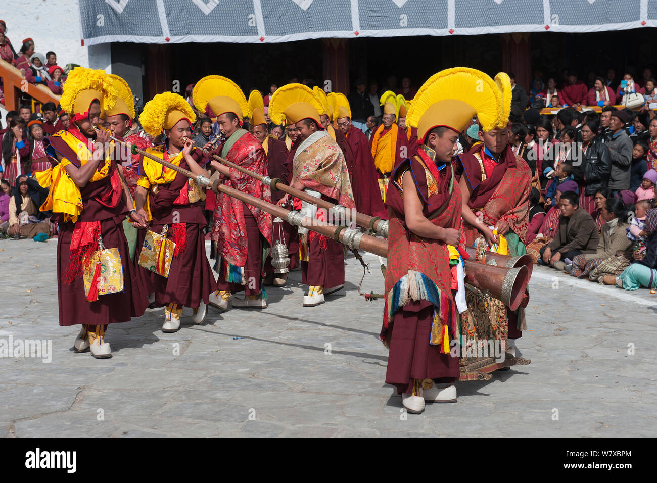 Buddhist monks playing long trumpets (Lawa) during Torgya festival ...