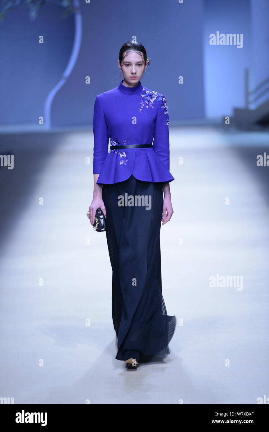 A model displays a new creation at the fashion show of Heaven Gaia by ...