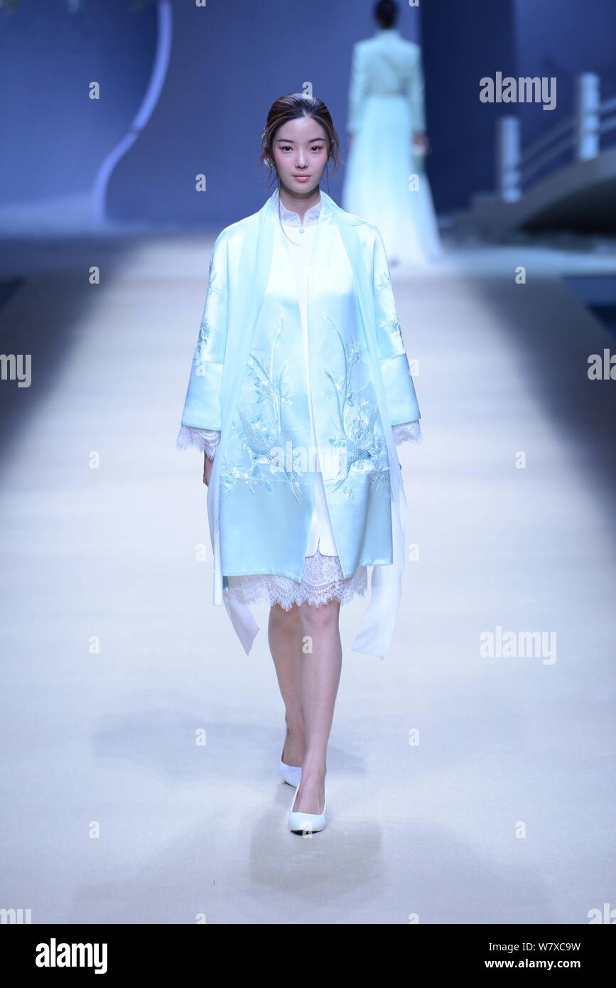 A model displays a new creation at the fashion show of Heaven Gaia by ...
