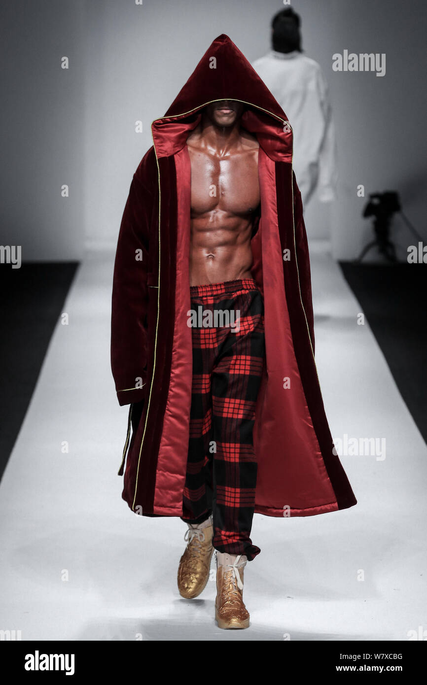 A model displays a new creation at the fashion show of SOLO CELEB. and ...