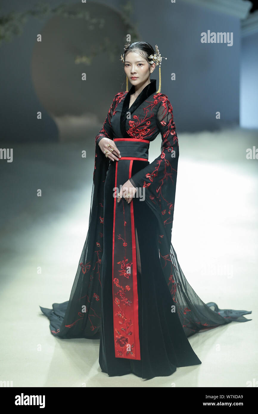 A model displays a new creation at the fashion show of Heaven Gaia by ...