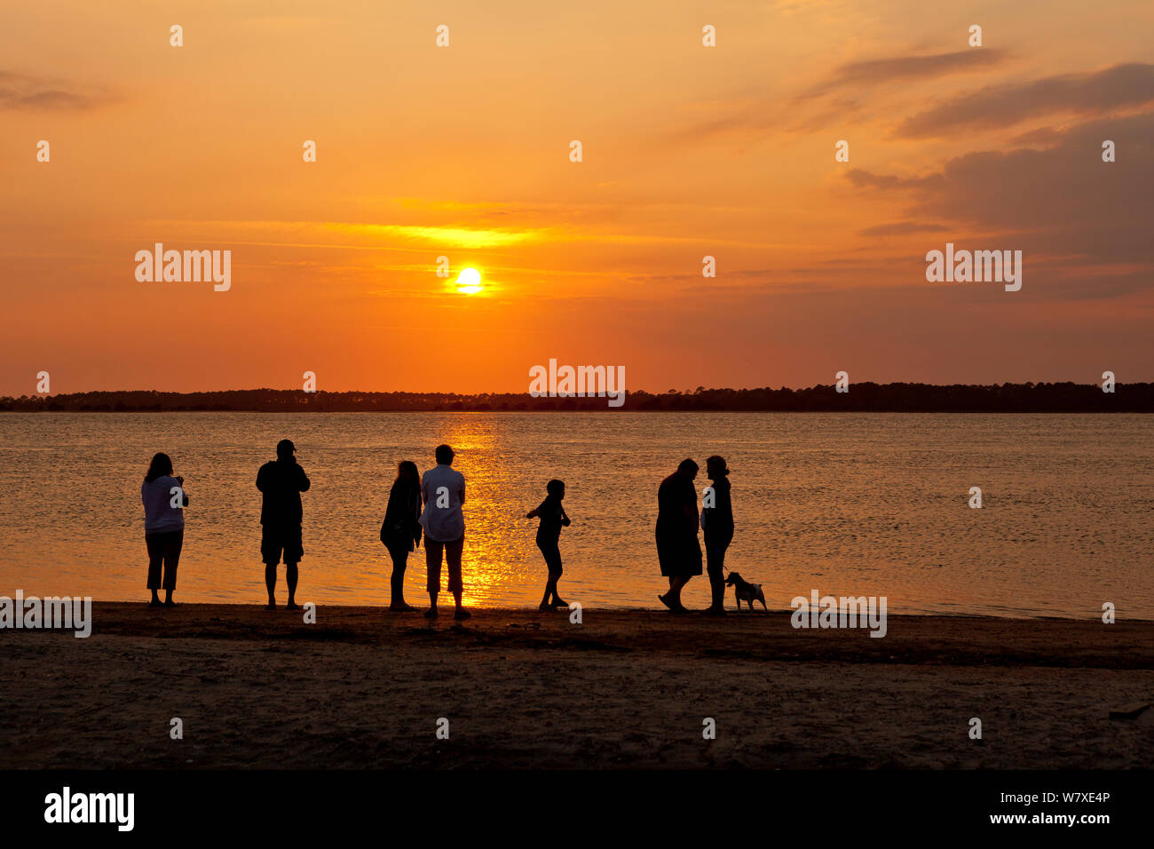 People watching the sunset on the beach at the south end of Edisto ...