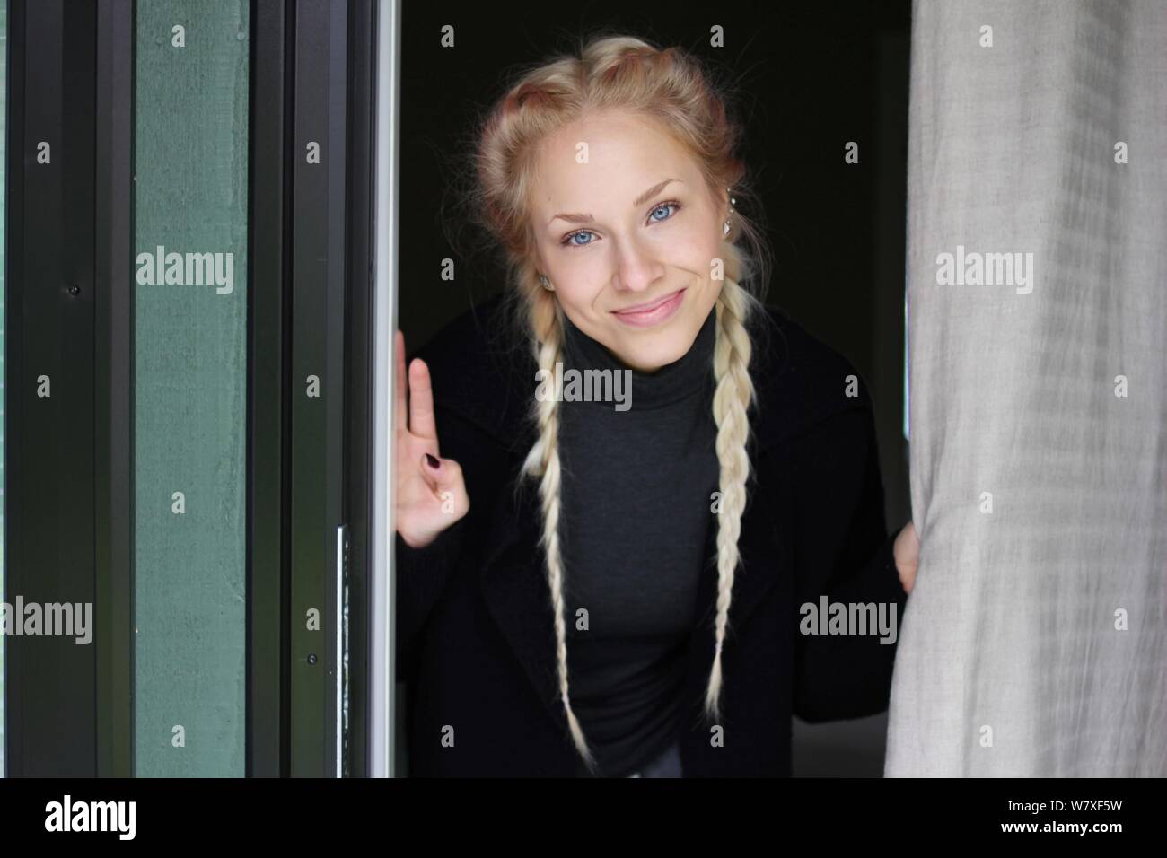 Female Leaning Head On Window Sill. Portrait Of Smiling Woman Stock ...