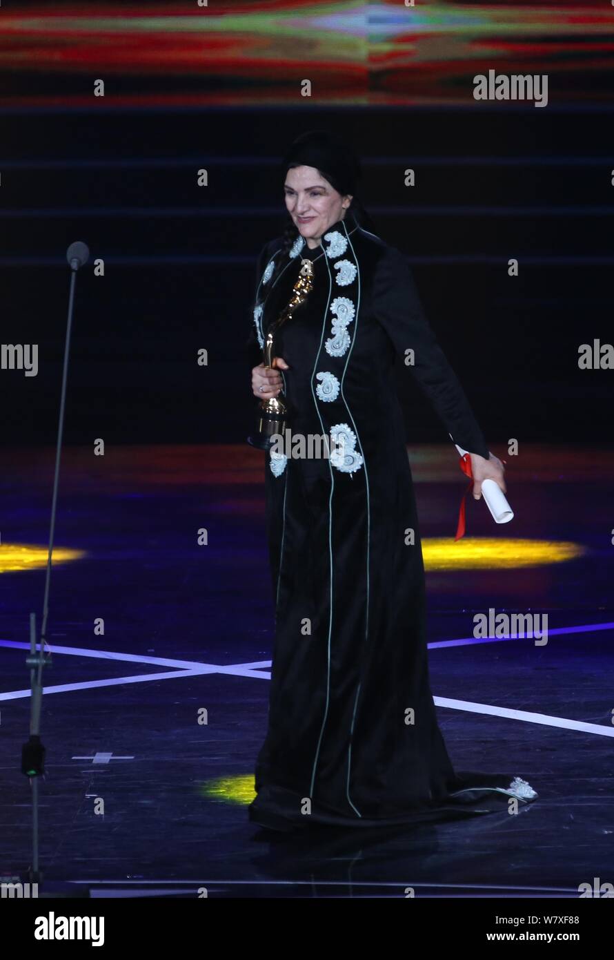 Iranian actress Golab Adineh poses with her trophy after winning the ...