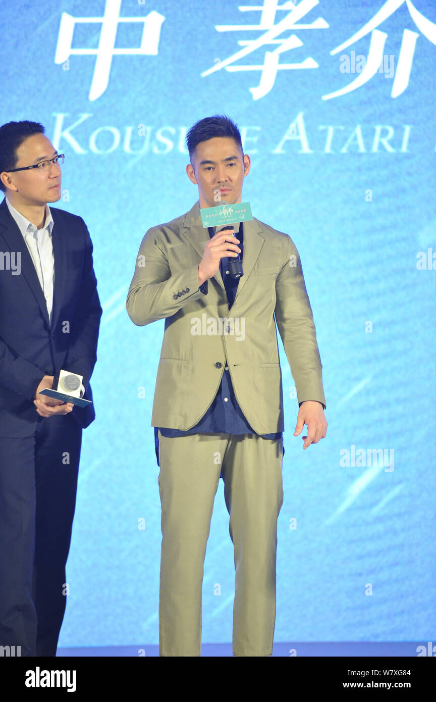 Japanese singer Kousuke Atari, right, is interviewed during a launch ...