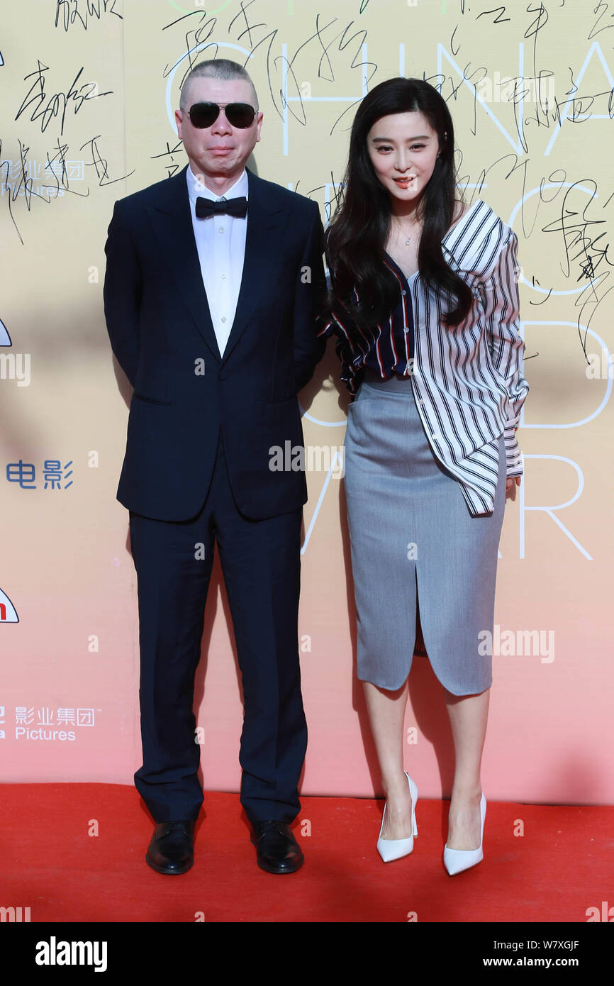 Chinese actress Fan Bingbing, right, and director Feng Xiaogang pose on ...