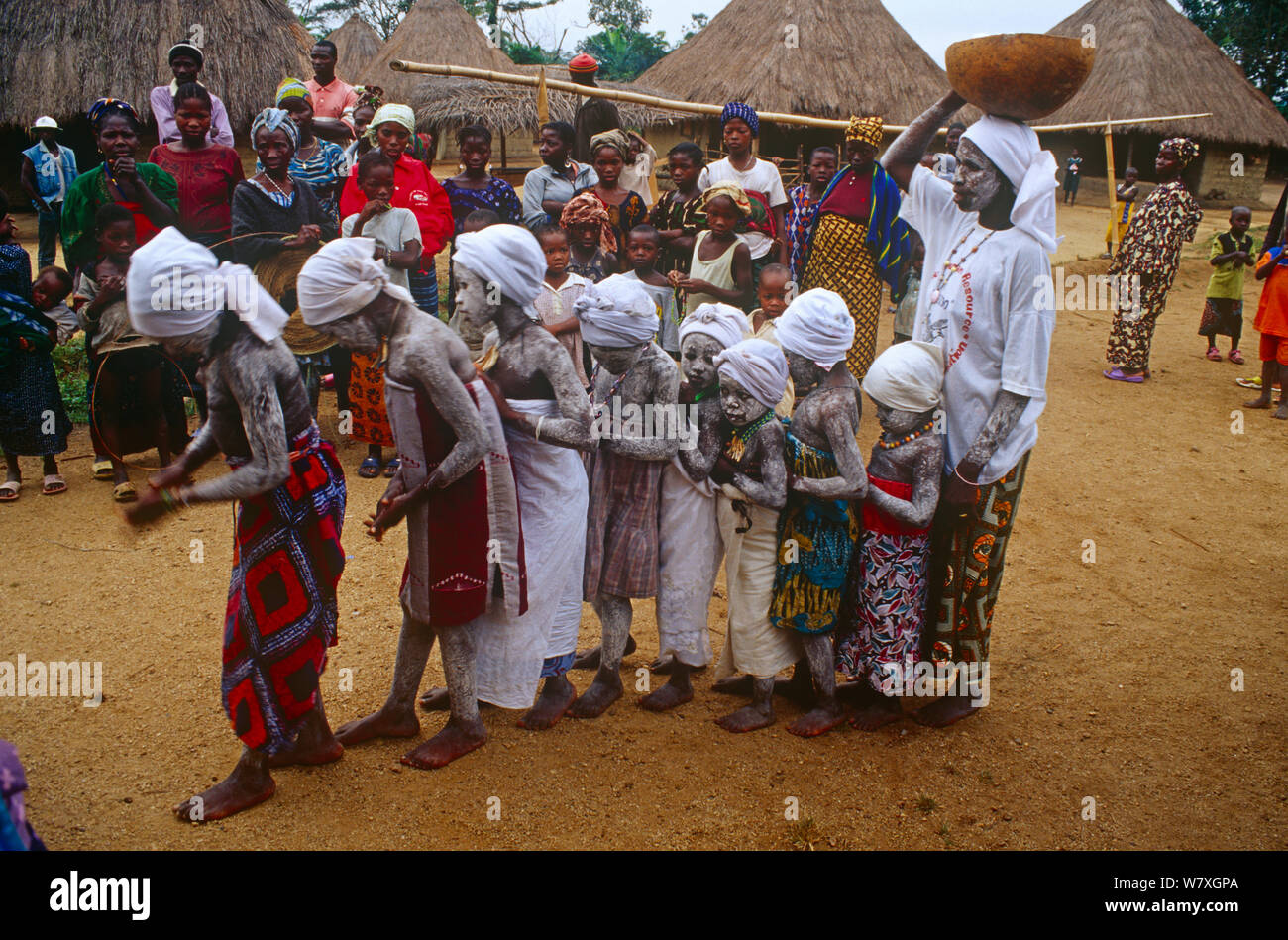 Young girls in traditional dress undergoing secret society initiations ...