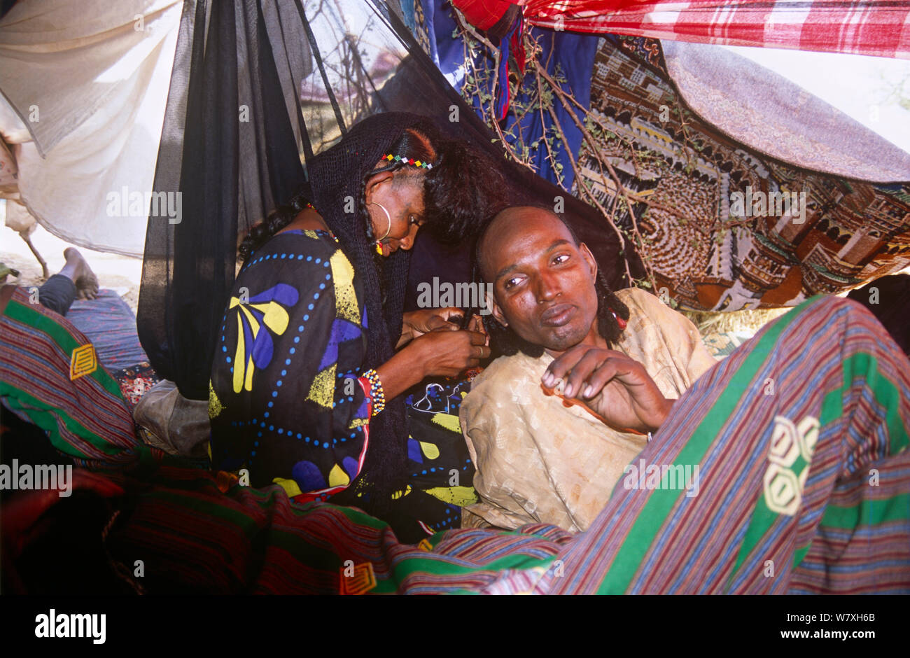 Peul / Fula people under cover at gathering for ritual ceremonies ...