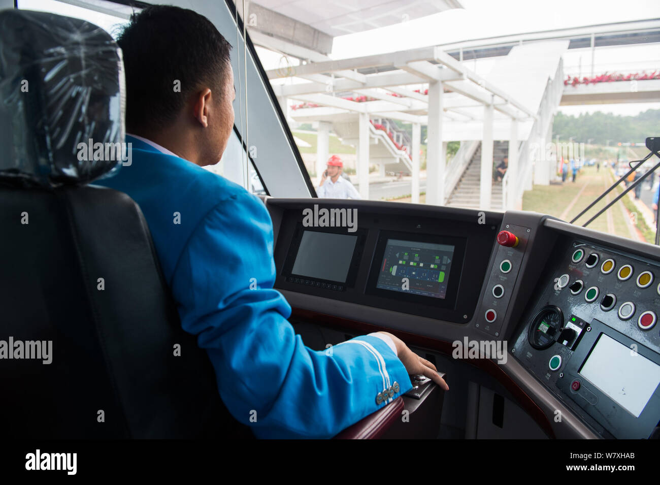 A worker drives a tram on the city's first tramline during a test run ...