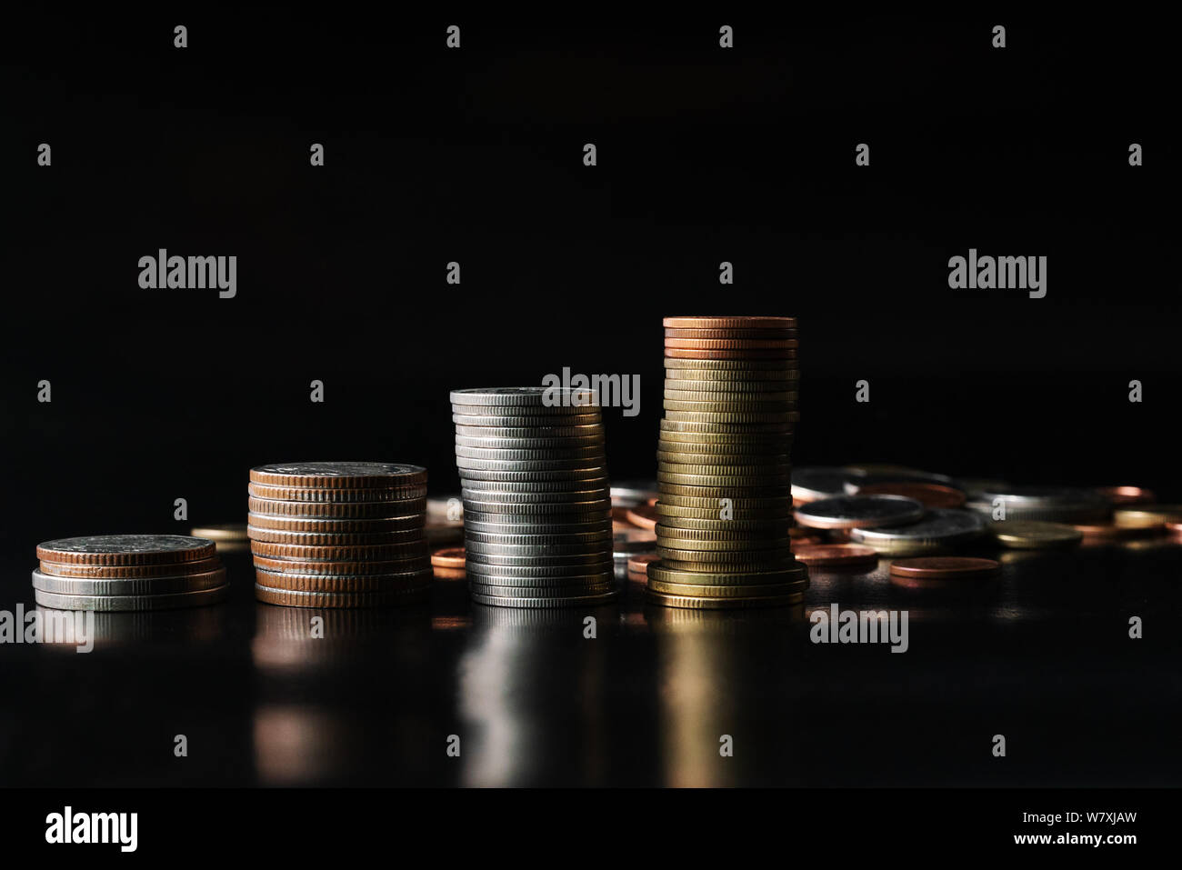 saving coin stack on black background, money saving concept Stock Photo ...