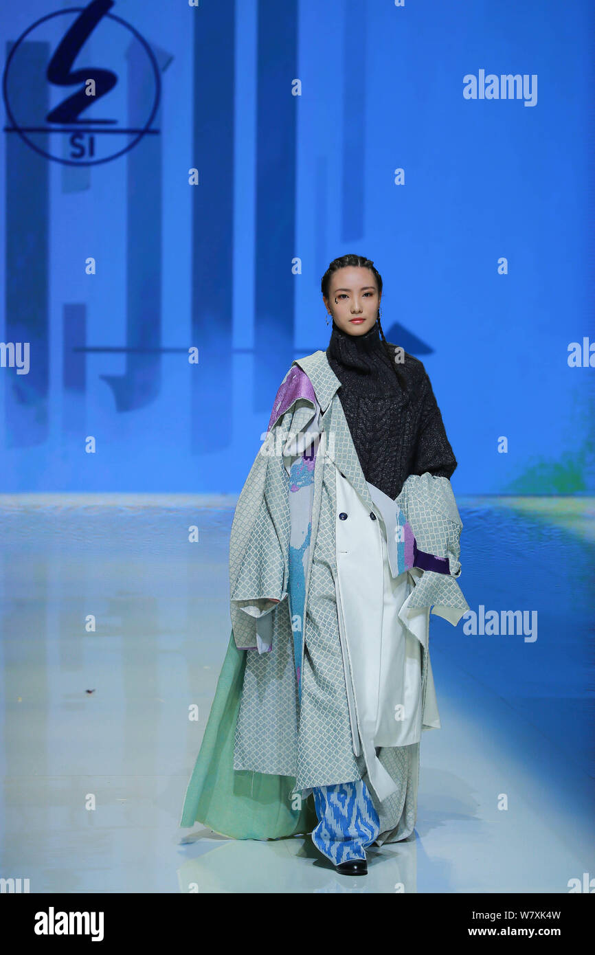 A model displays a creation by a graduate during a fashion show for ...
