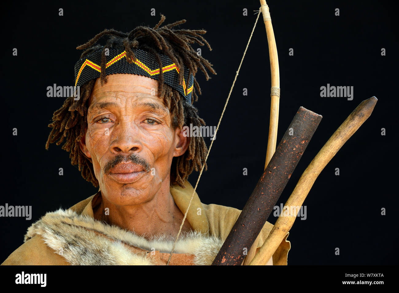 Portrait of Naro San Bushman wearing traditional clothing and headband ...