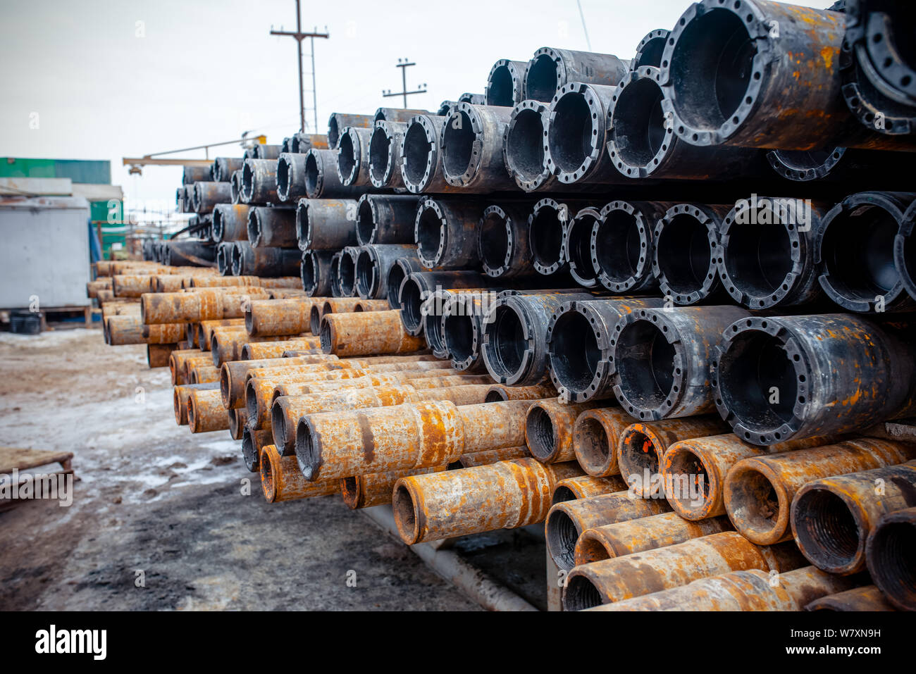 Drill pipe of oil drilling platforms. Stack of oil well casing bundles ...