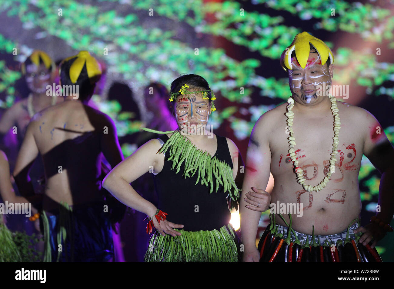 Chinese people display costumes made from vegetables in Dao county ...