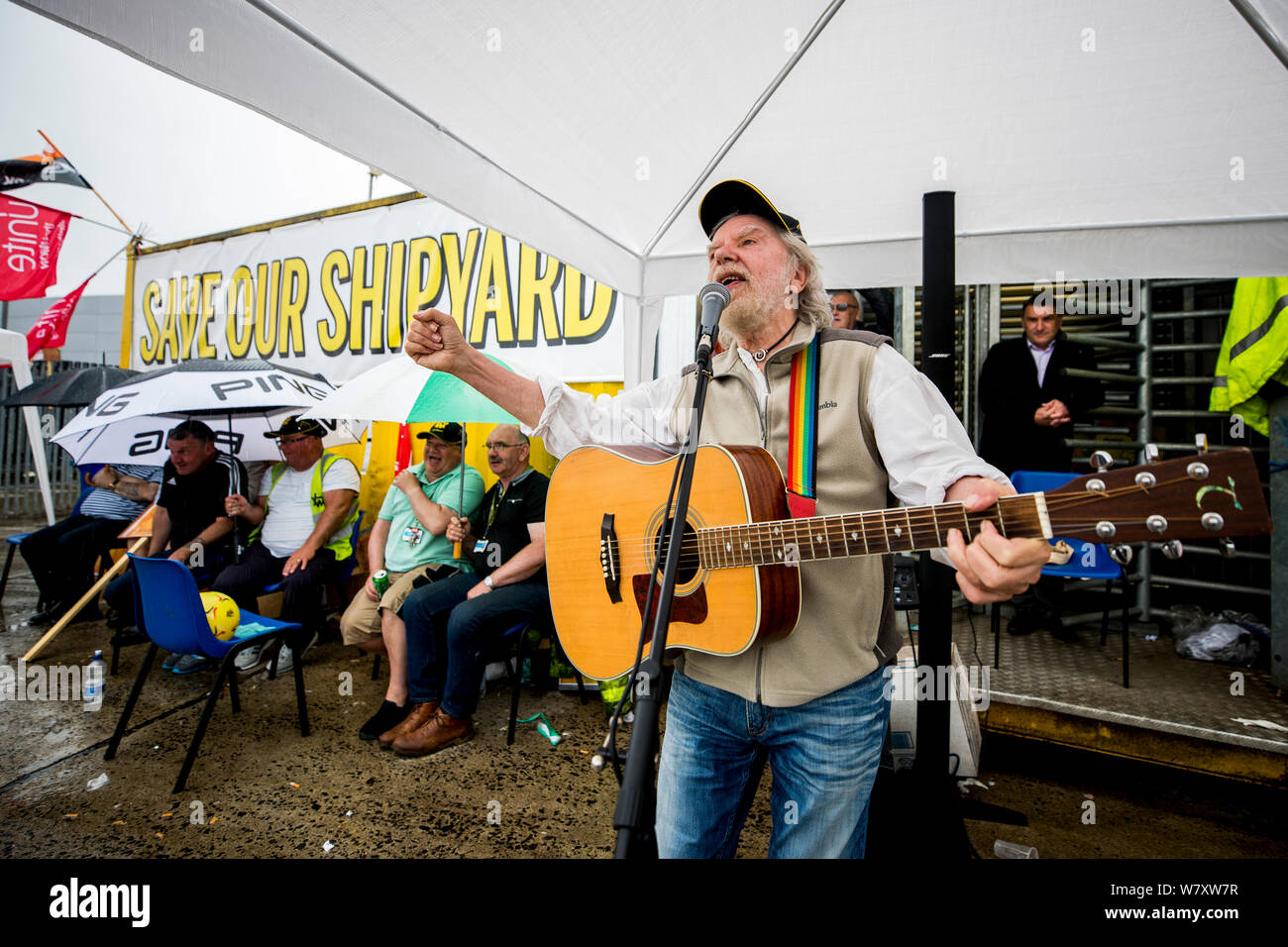 Irish singer songwriter Tommy Sands performing at the gates of Harland ...