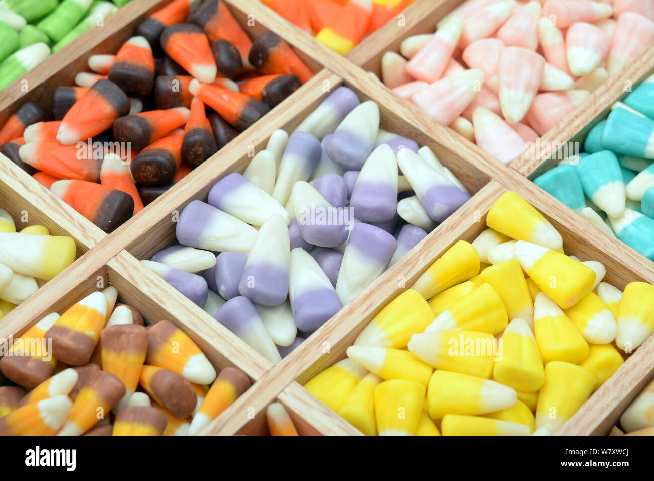 many kinds of flavor teeth candies in wooden box Stock Photo - Alamy