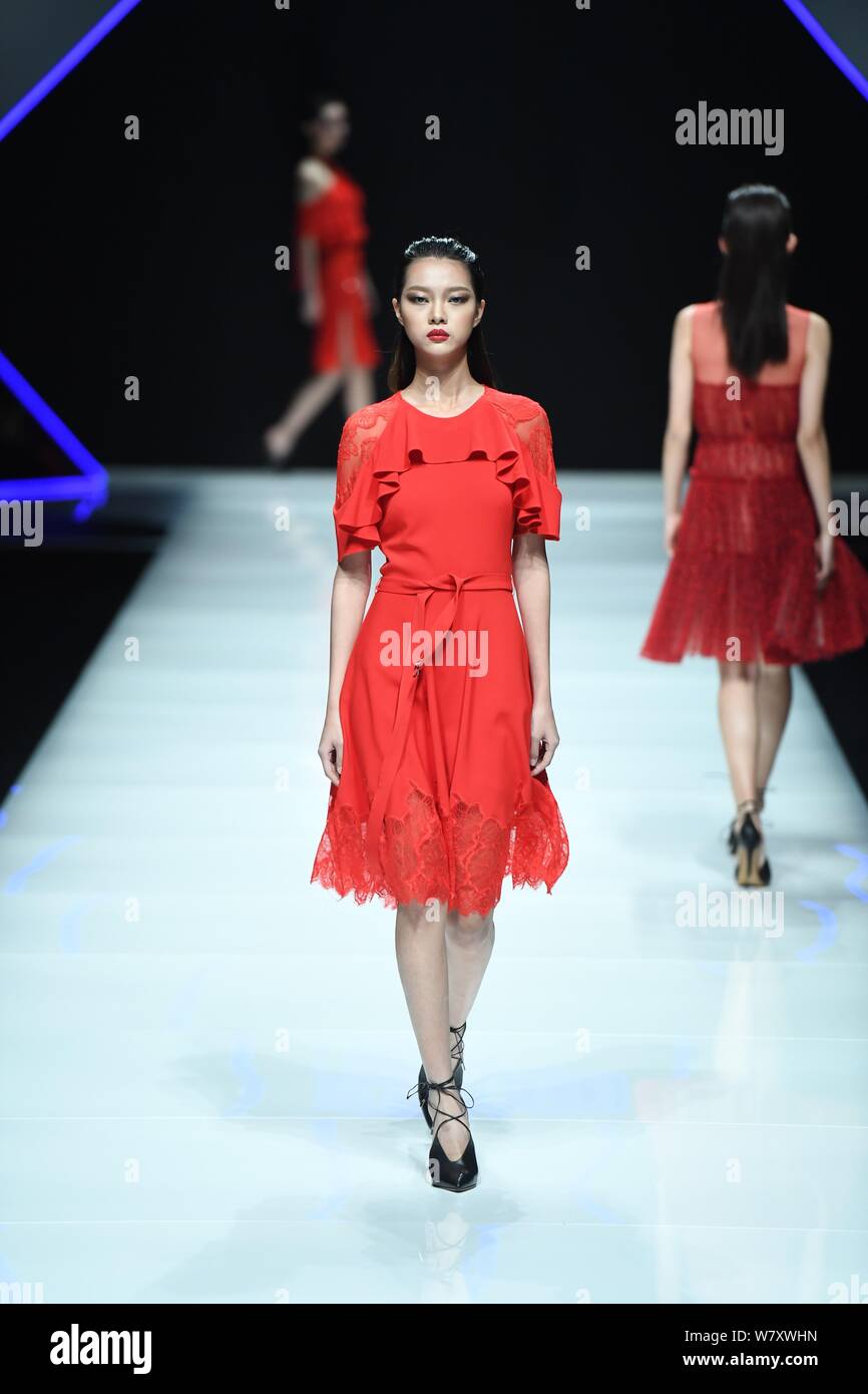 A model displays a new creation at the Asahi Kasei Chinese Fashion ...