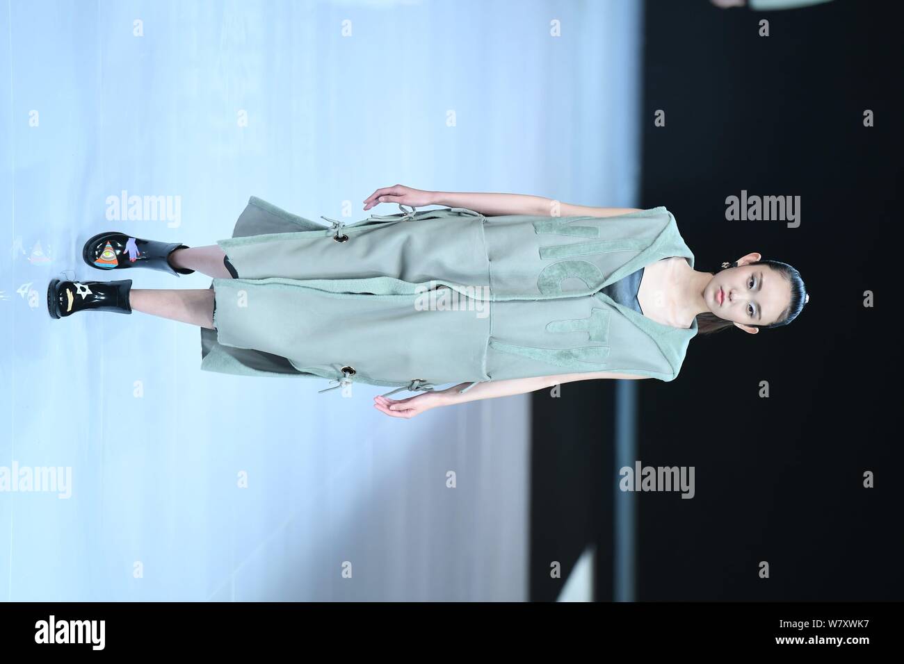 A model displays a new creation at the fashion show of POLY BRIGHT by ...