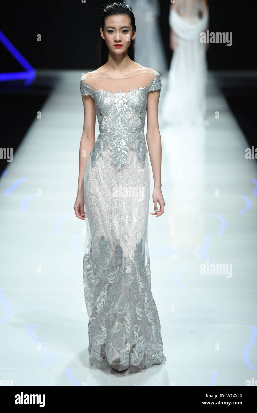 A model displays a new creation at the Asahi Kasei Chinese Fashion ...