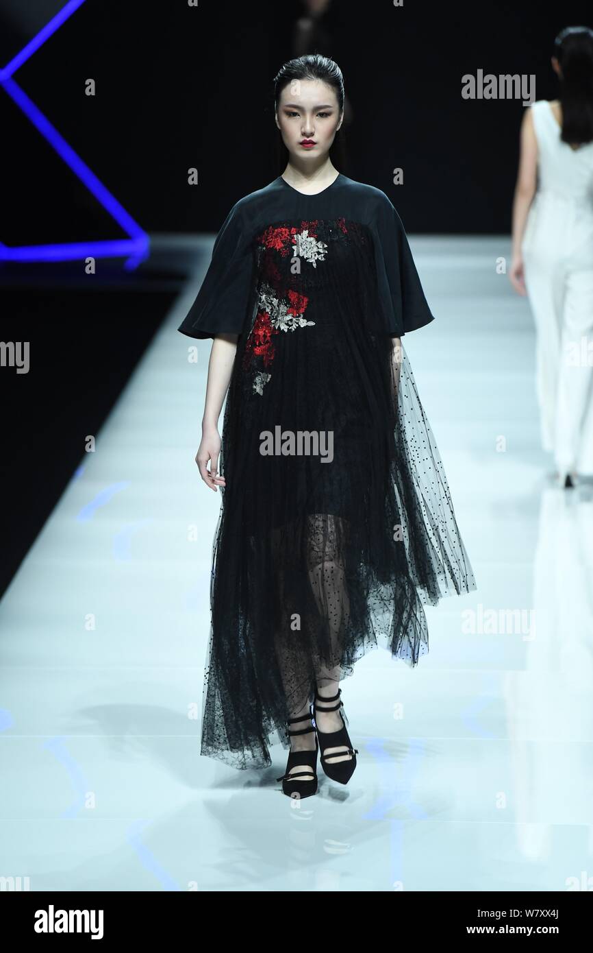 A model displays a new creation at the Asahi Kasei Chinese Fashion ...