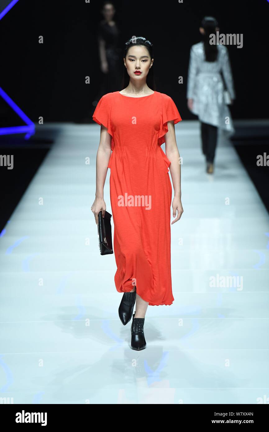 A model displays a new creation at the Asahi Kasei Chinese Fashion ...