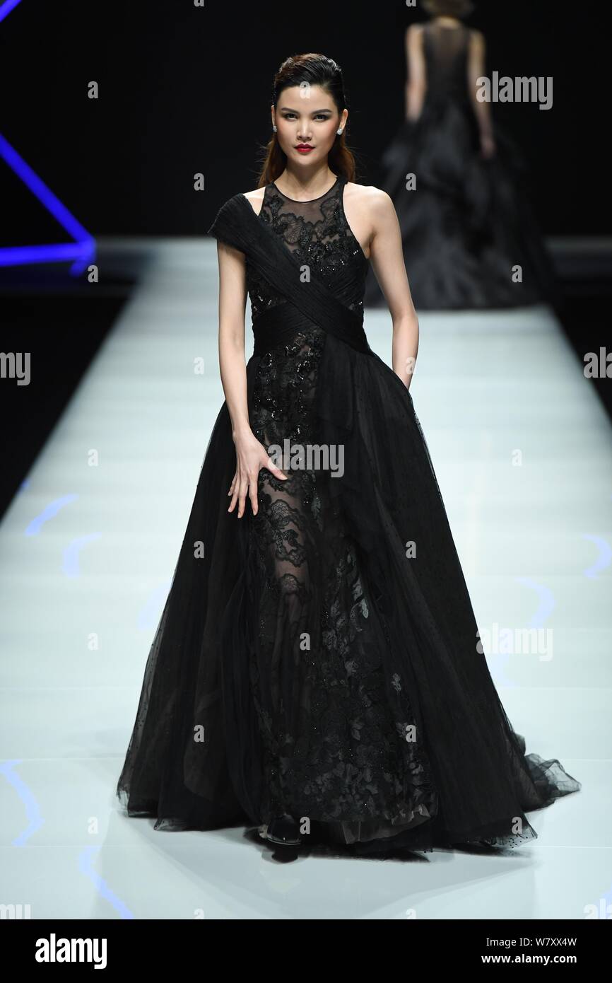 A model displays a new creation at the Asahi Kasei Chinese Fashion ...