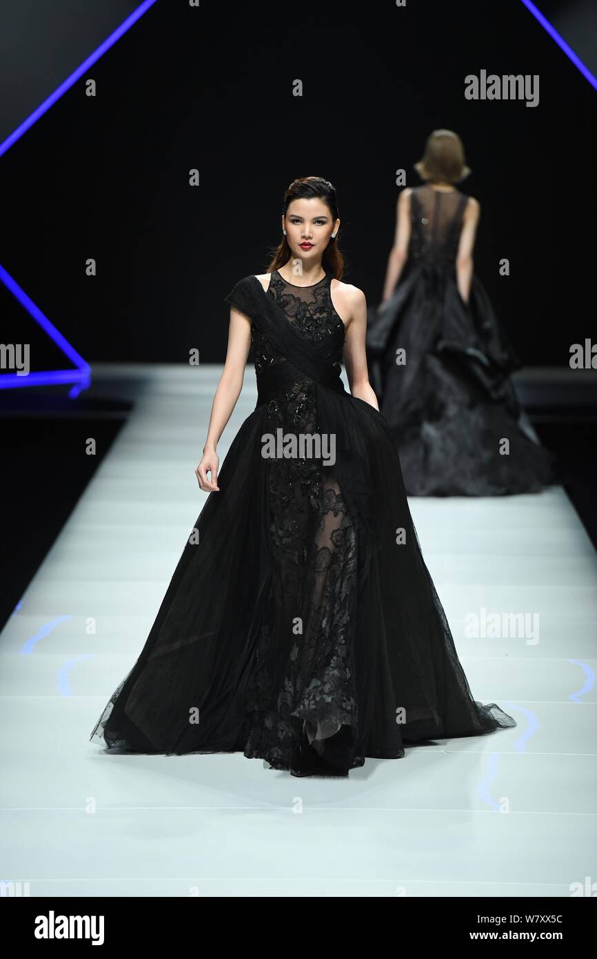 A model displays a new creation at the Asahi Kasei Chinese Fashion ...