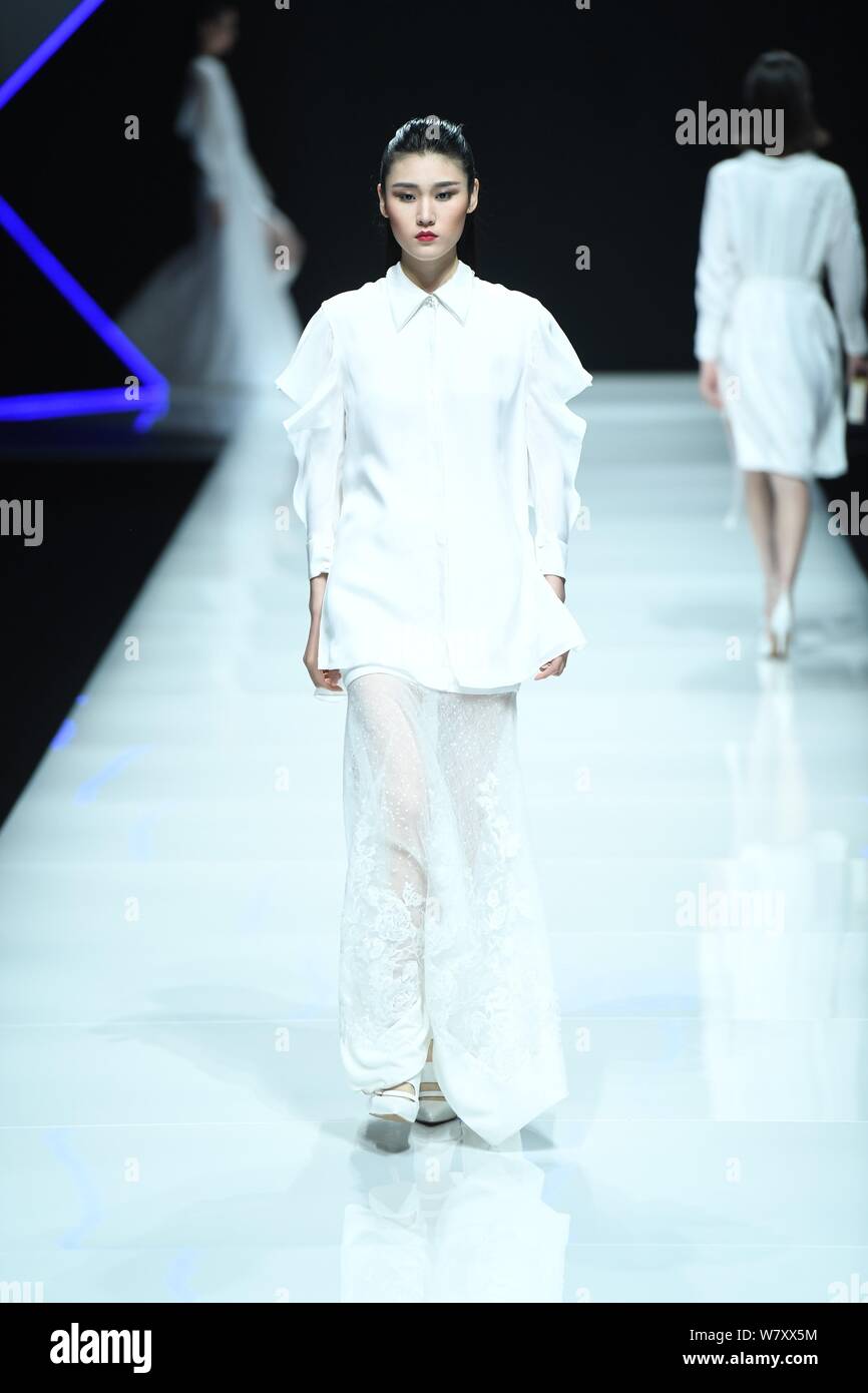 A model displays a new creation at the Asahi Kasei Chinese Fashion ...