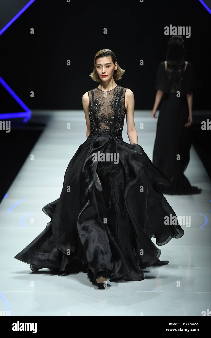 A model displays a new creation at the Asahi Kasei Chinese Fashion ...