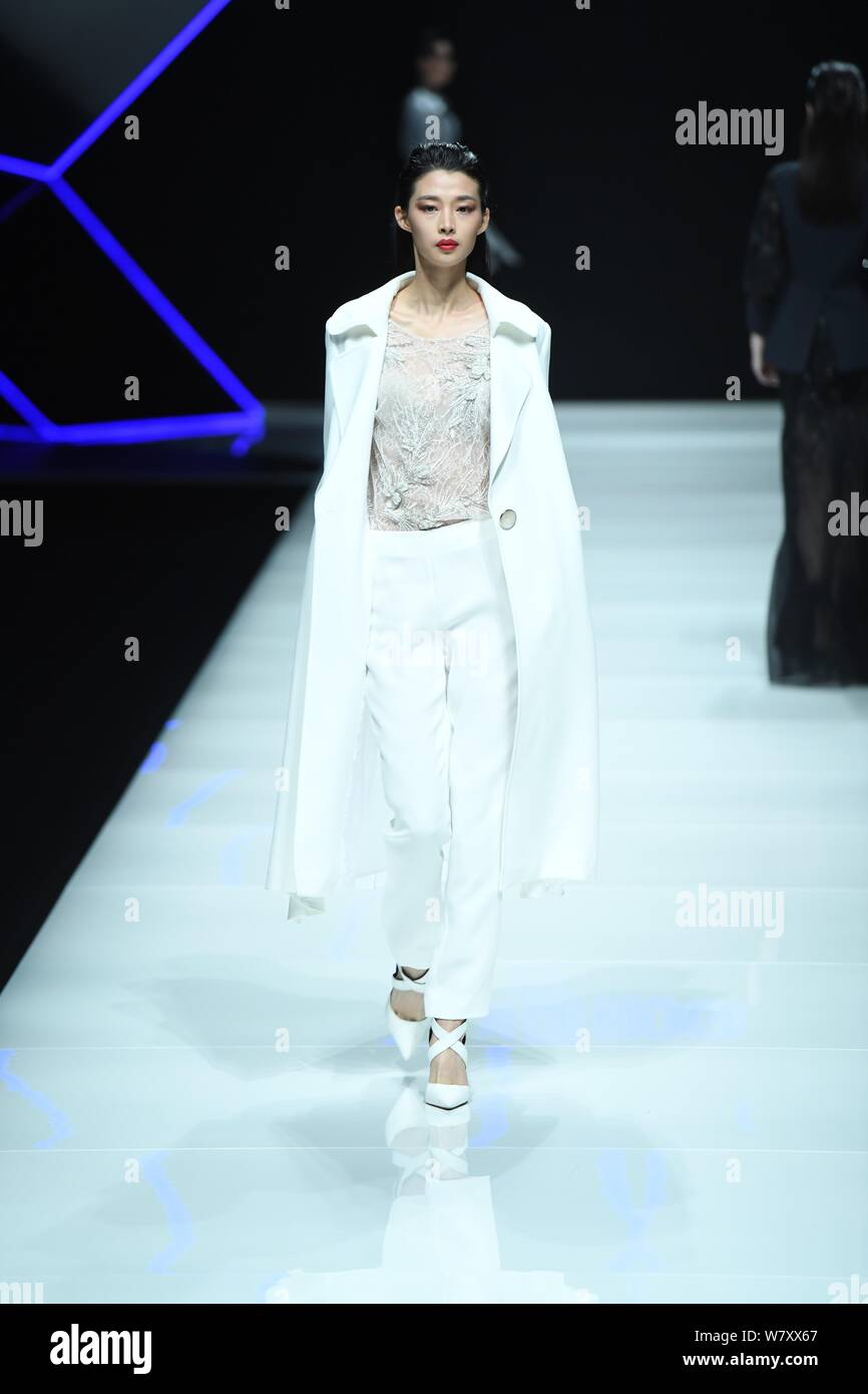 A model displays a new creation at the Asahi Kasei Chinese Fashion ...