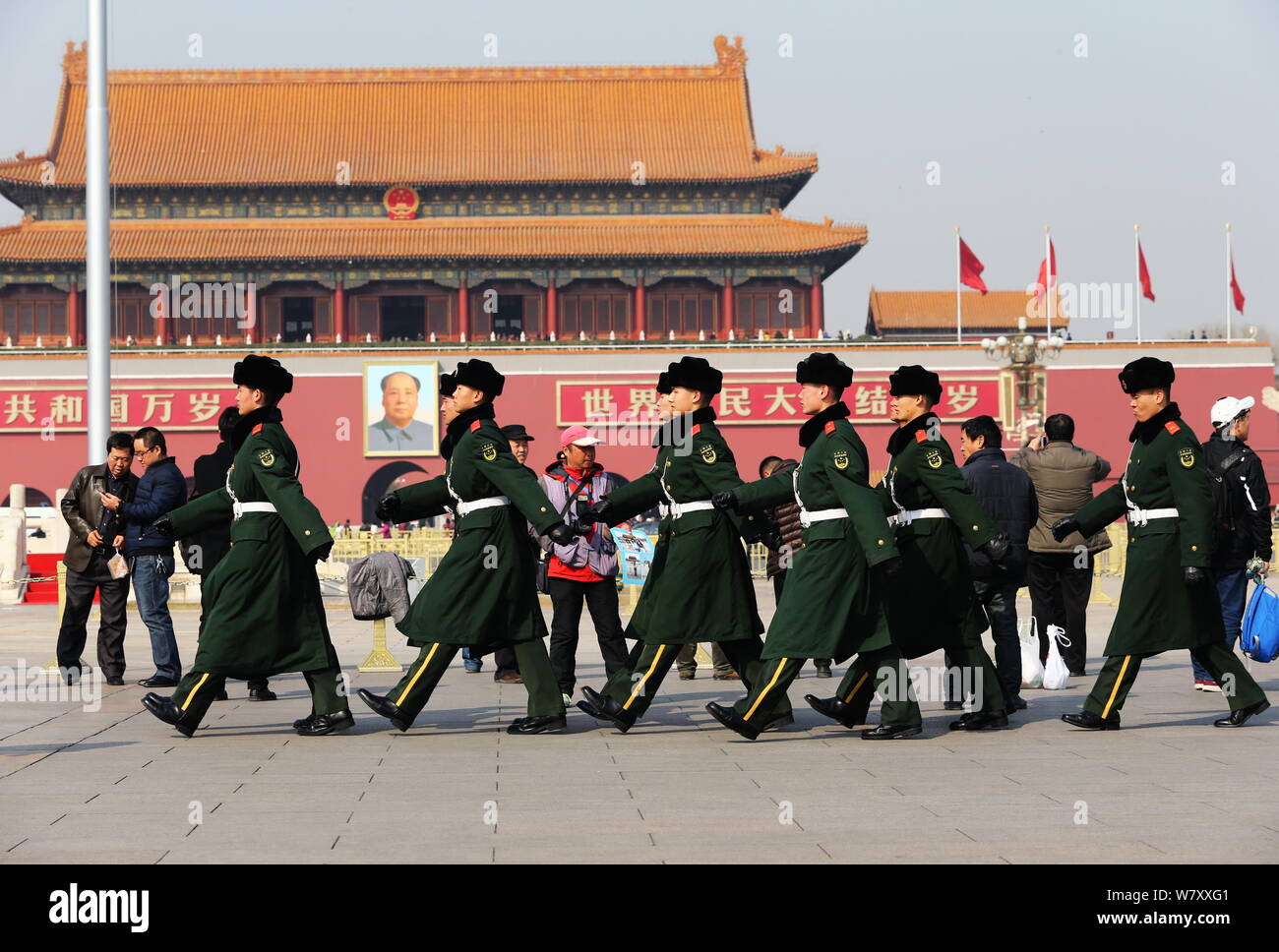 Chinese paramilitary policemen patrol the Tian'anmen Square ahead of ...