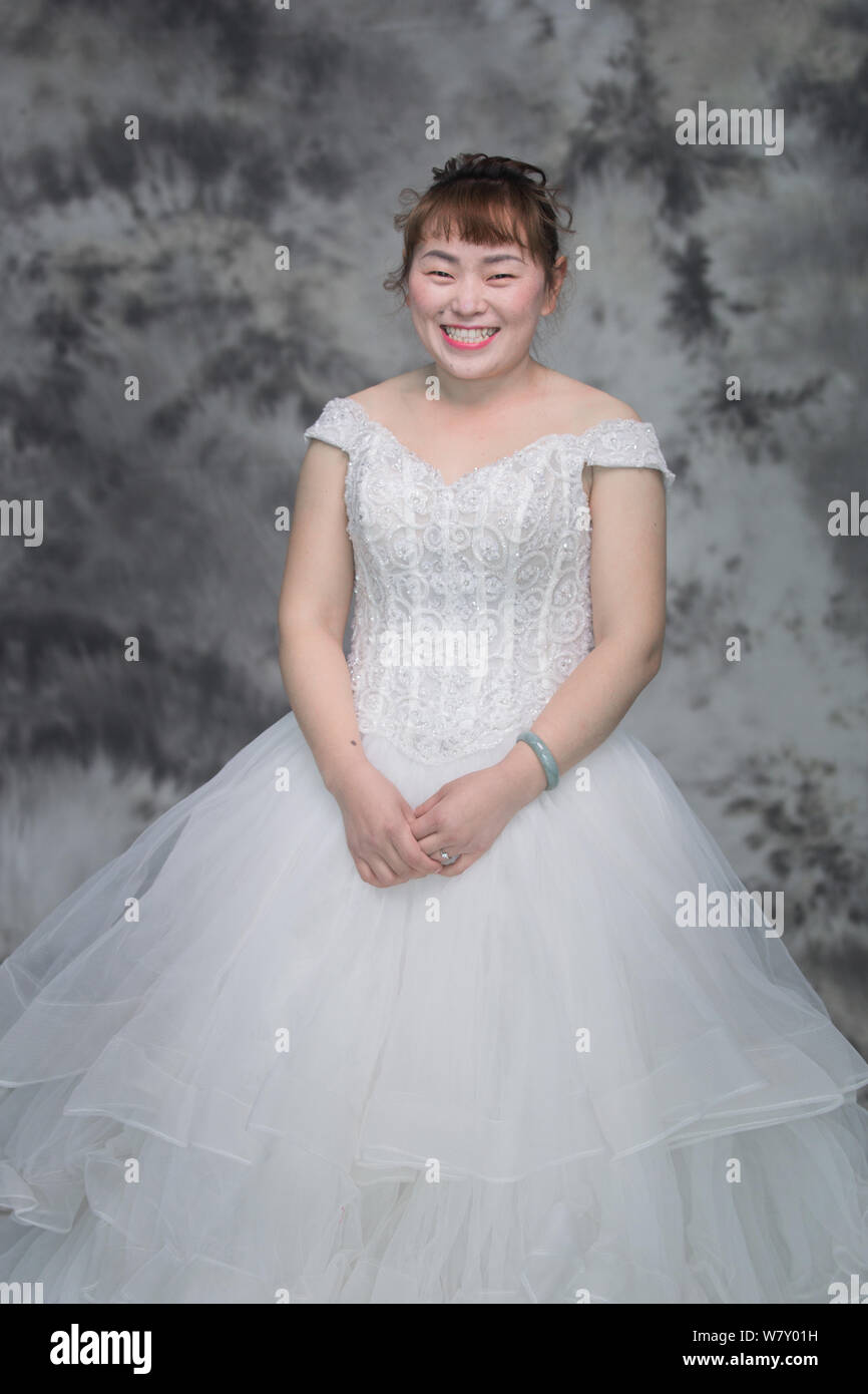 Female Chinese mason Yang Jianhua, 32, from Chongqing, poses for a ...