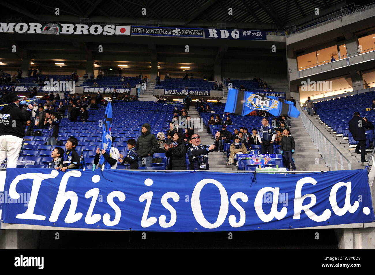 Football fans shout slogans to show support for Japan's Gamba Osaka in ...