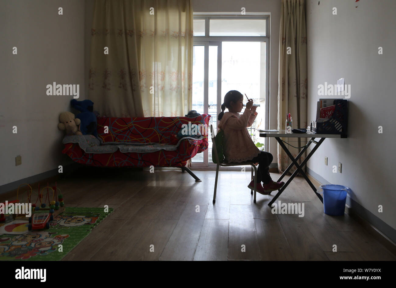 Chinese autistic girl Chenchen is seen in her room at home in Chengdu ...