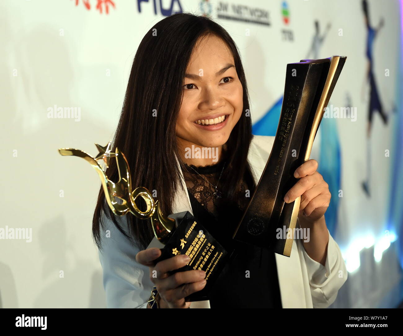 Hong Kong racing cyclist Sarah Lee Wai Sze poses with her trophies ...