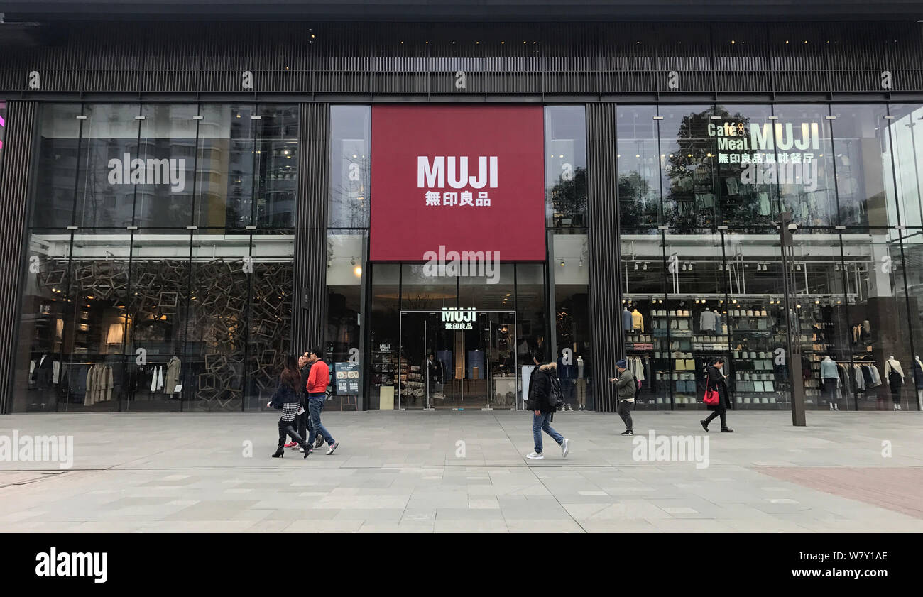 Pedestrians walk past a store of Muji in Chengdu city, southwest China ...