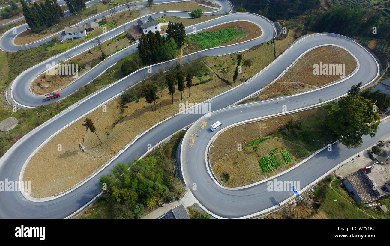Aerial view of a winding mountain road with 10 hairpin turns in ...