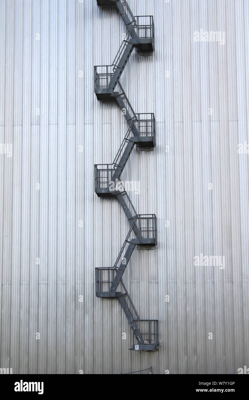 Upright view of fire escape stairs from a tall building Stock Photo - Alamy