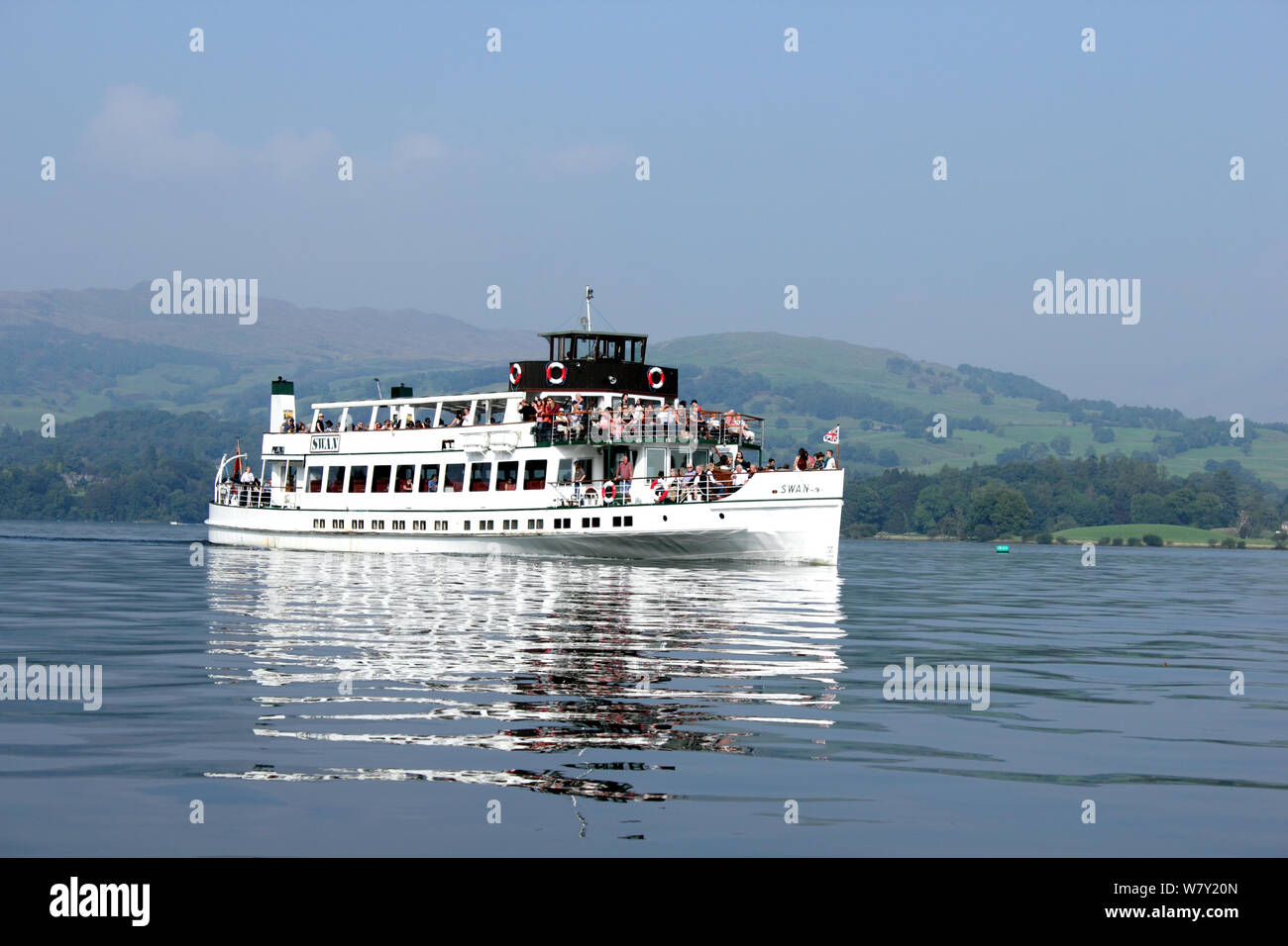 Landscape view of MV Swan sailing on Lake Windermere with deep blue sky ...