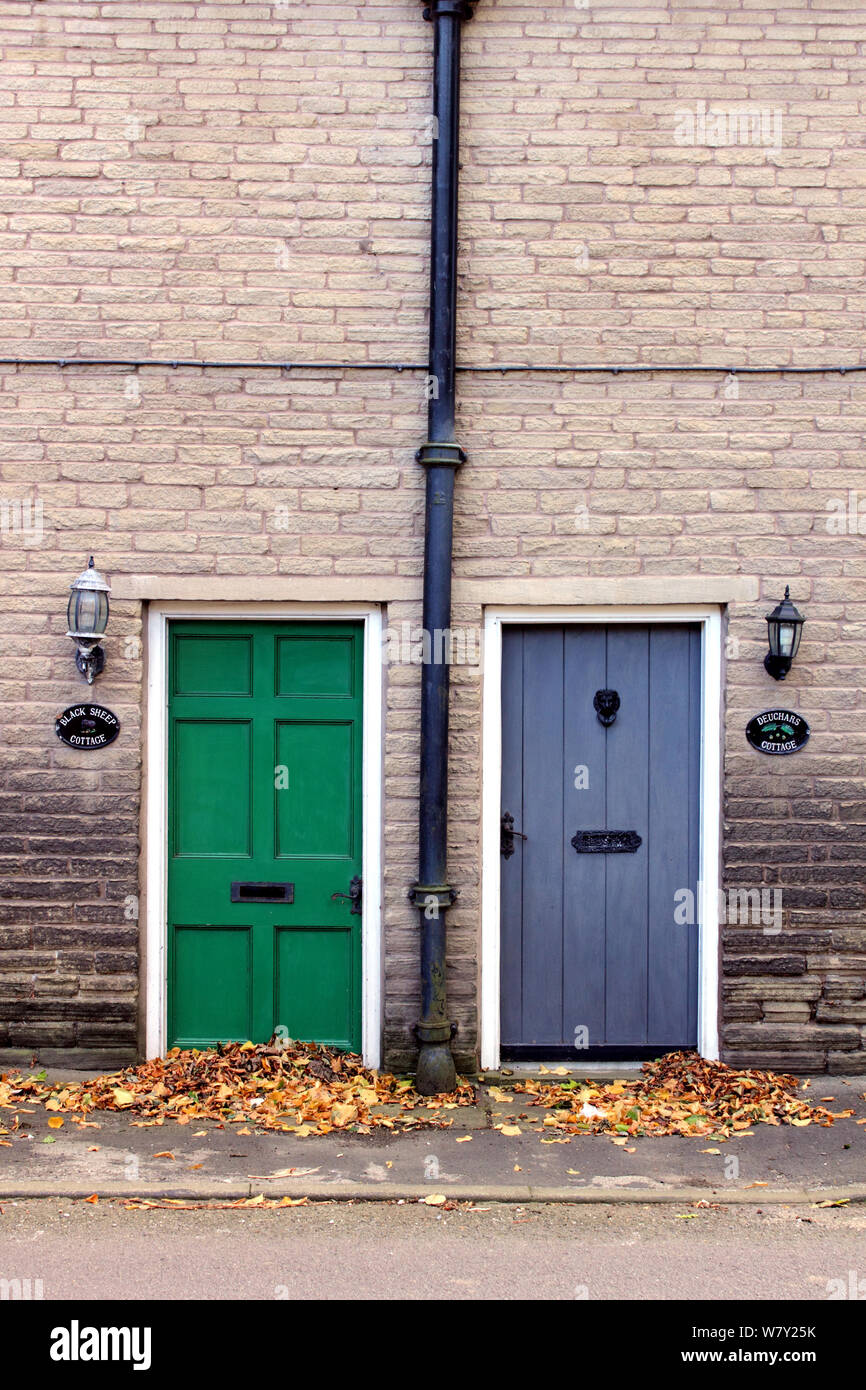 Symmetrical view of two differently coloured doors Stock Photo - Alamy