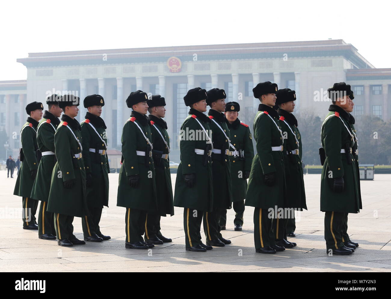 Chinese paramilitary policemen patrol the Tian'anmen Square ahead of ...