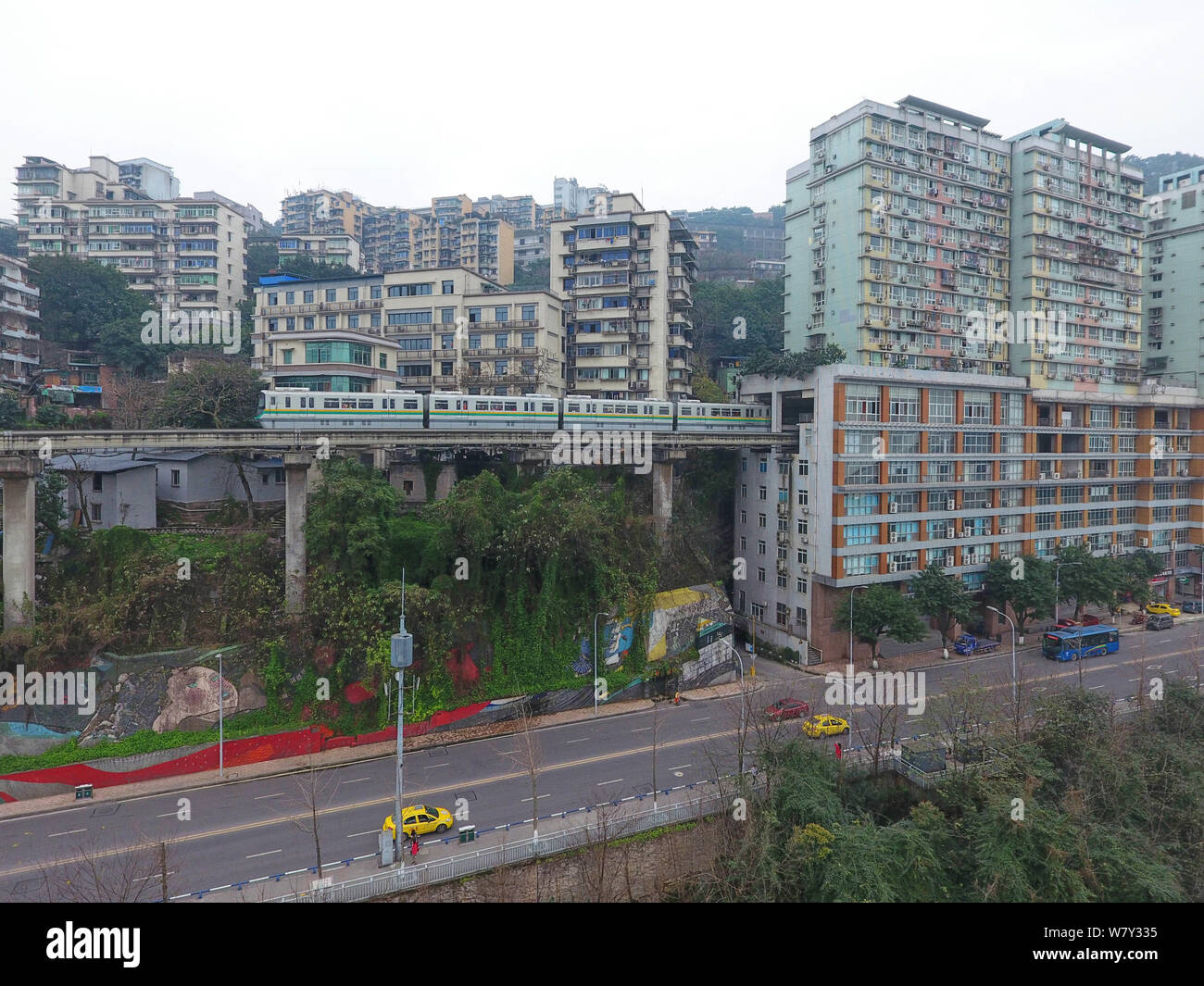 A subway train of Chongqing Light rail Line 2 arrives at the Liziba ...