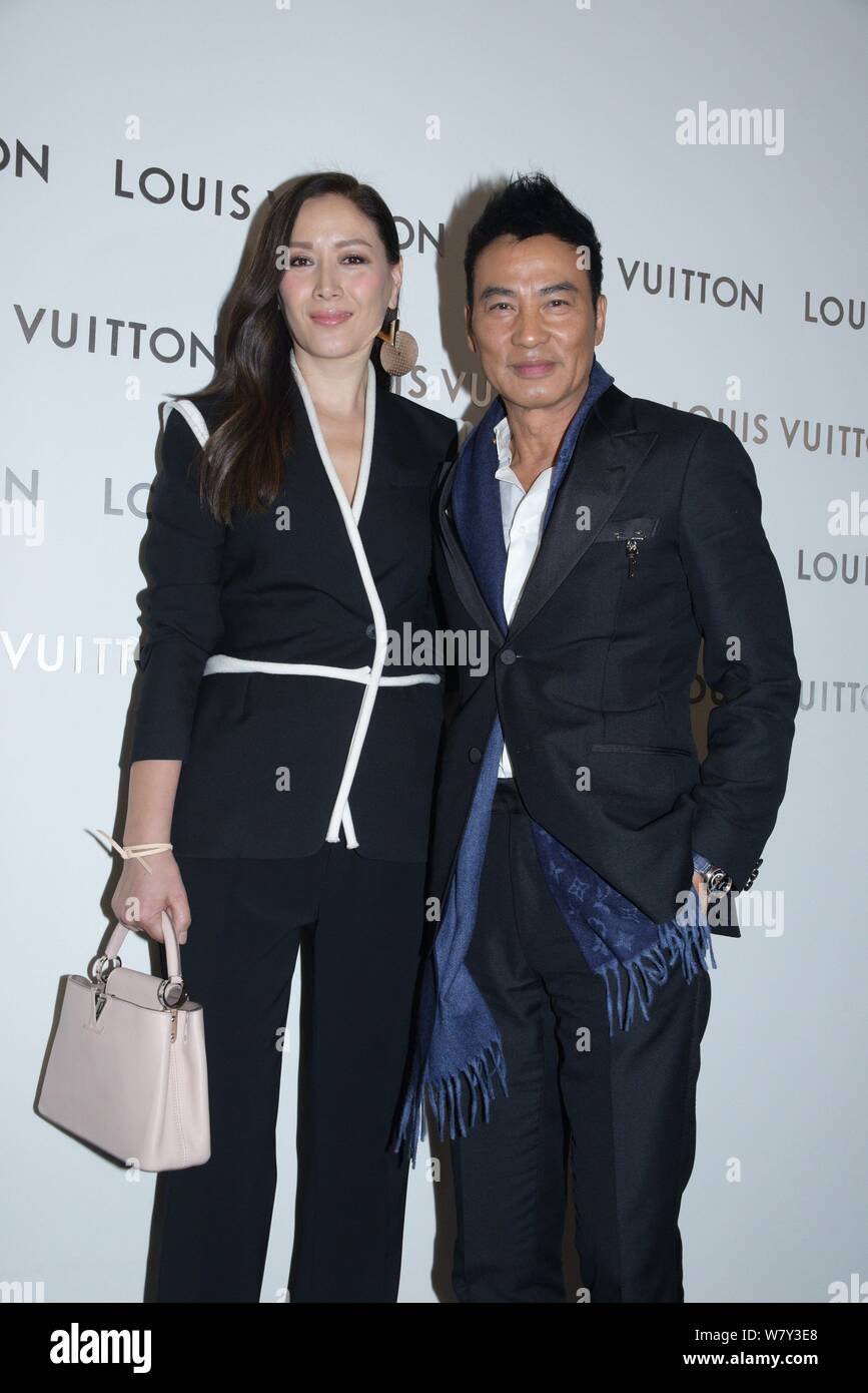Hong Kong actor Simon Yam, right, and his model wife Sophia Kao pose at ...