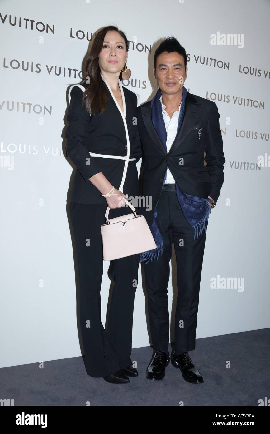 Hong Kong actor Simon Yam, right, and his model wife Sophia Kao pose at ...