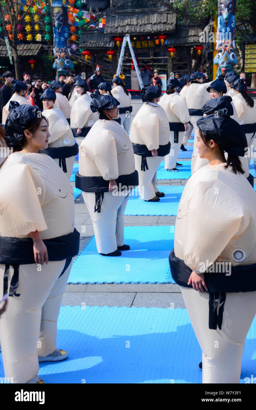 Chinese women dressed in inflatable sumo-wrestler costumes took part in ...